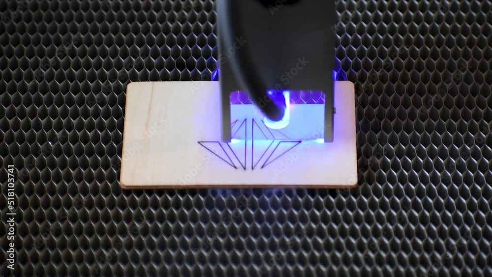 Diode laser engraving and cutting a polygonal heart model on wood Stock ...