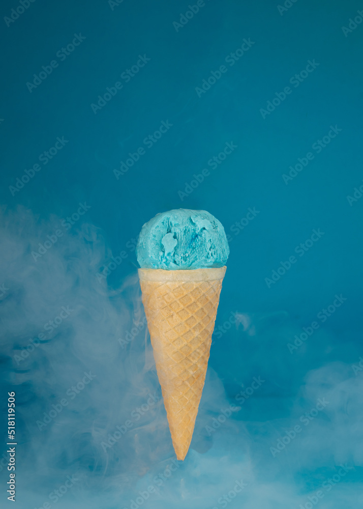 Mystical scene with frozen blue ice cream with smoke all over it ...