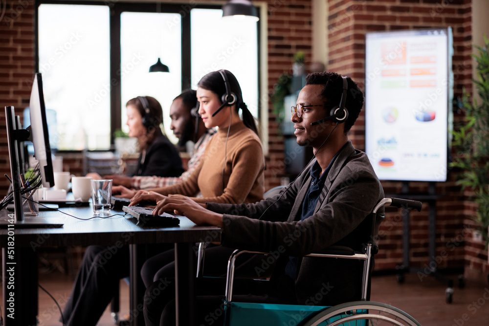 African american call center operator living with disability and using ...