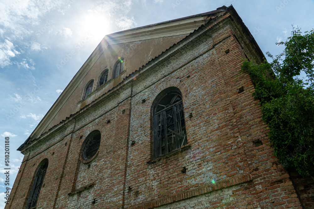 An old brick non-residential building. An ancient historical building ...