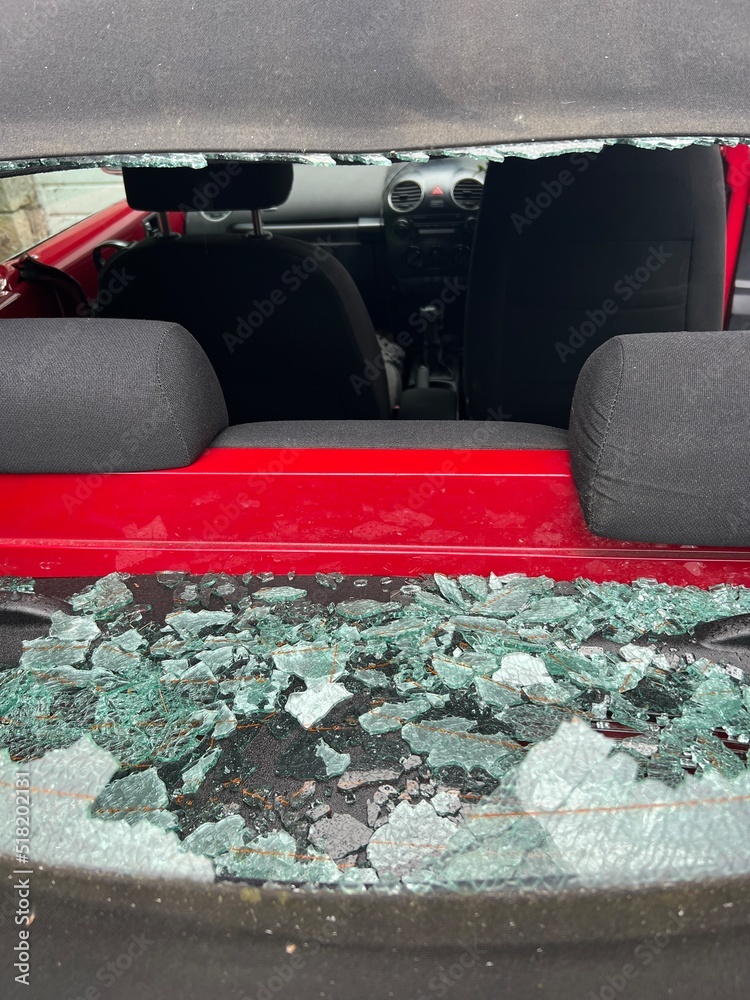 Close up of car accident smashed rear heated glass window on mohair ...