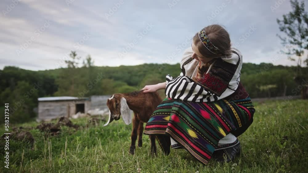 Vidéo Stock Young Slavic woman caressing baby goat. Happy young ...
