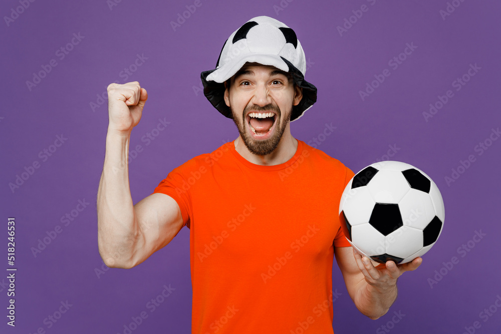 Young excited happy fan man he wears orange t-shirt cheer up support ...