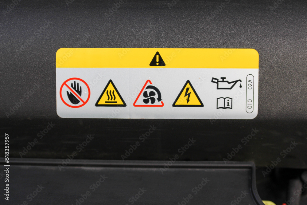 Warning label in the engine bay of a modern vehicle Stock Photo | Adobe ...
