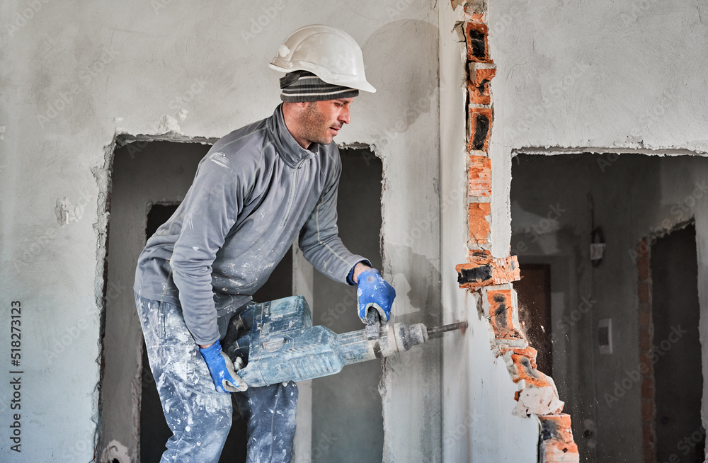 Side view male professional of demolition walls in construction helmet ...