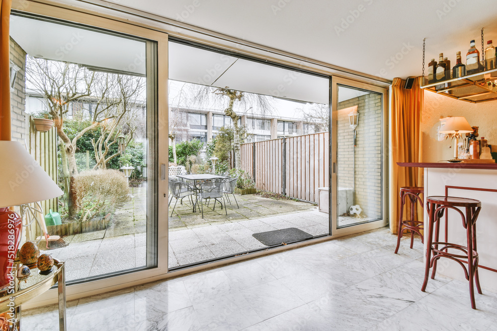 Bar counter and dining room next to bright windows Stock Photo | Adobe ...