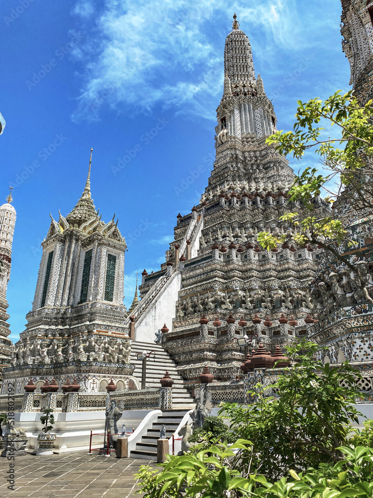 Wat Arun Temple in Bangkok, Thailand with stone pyramid towers, golden ...