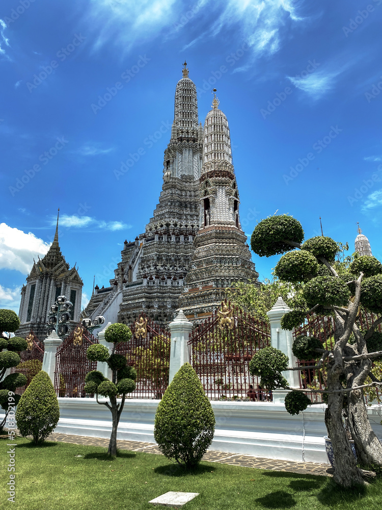 Wat Arun Temple in Bangkok, Thailand with stone pyramid towers, golden ...
