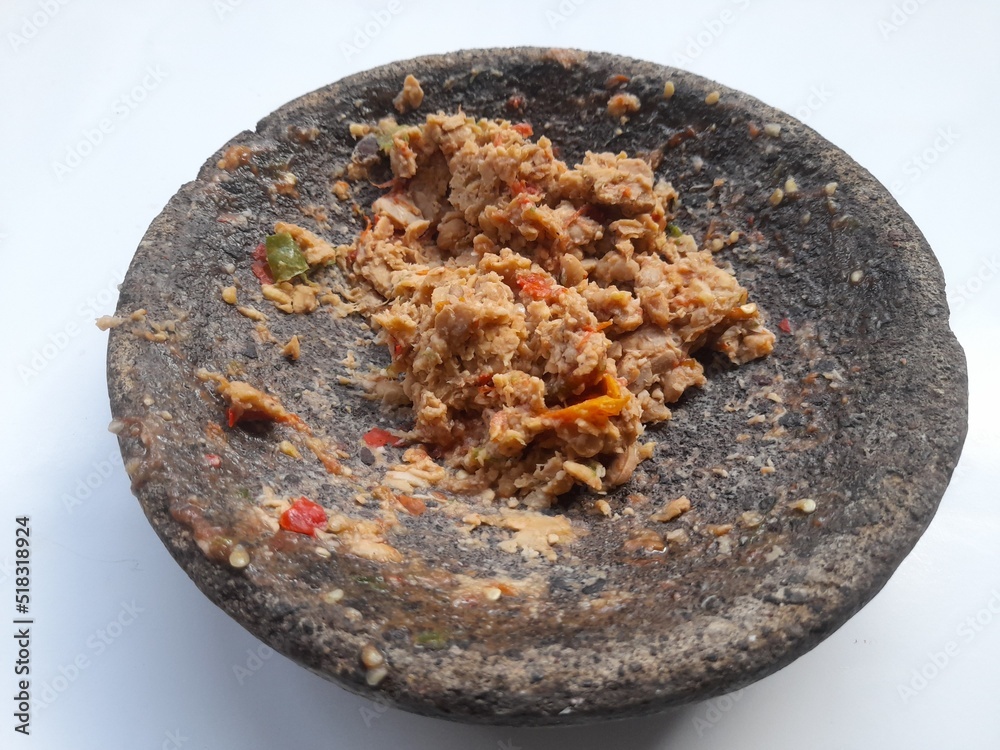 mashed tempeh sambal in mortar, top view on a white background. healthy ...