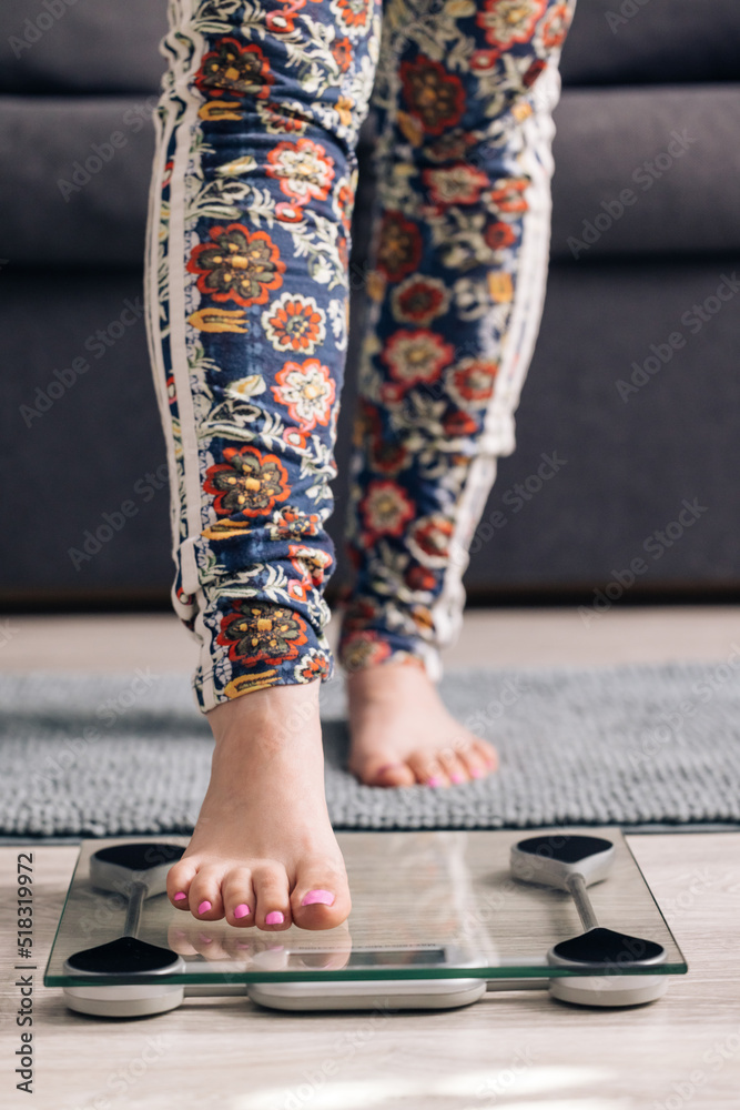 Girl Legs Step On Bathroom Scale. Woman On Scales Measure Weight. Human ...
