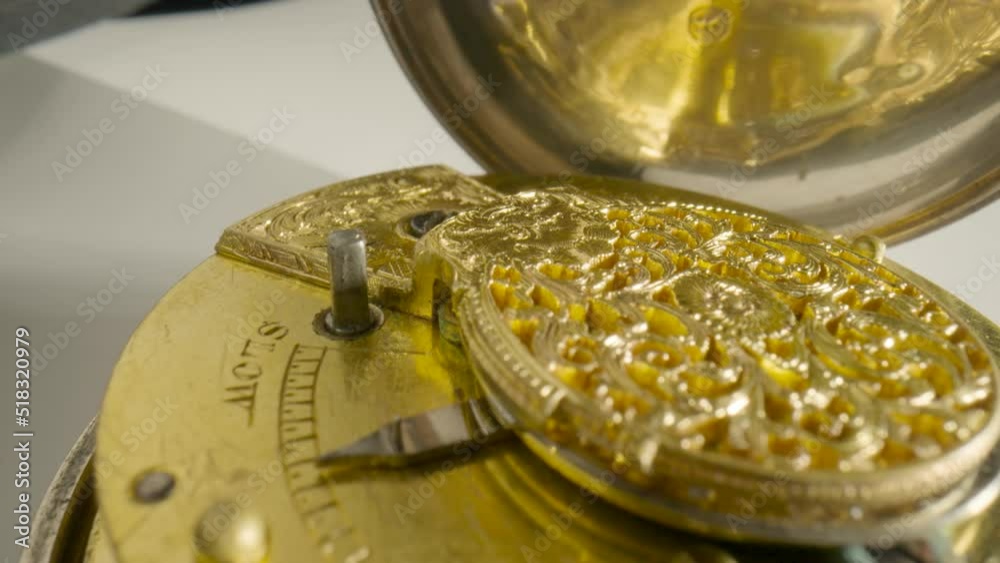 Clockwork mechanism with rotating spring, gears and gearing. Round ...