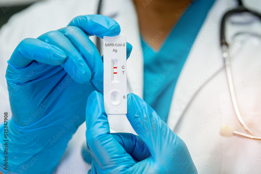 Asian doctor in PPE suit show positive test result with Saliva Antigen ...