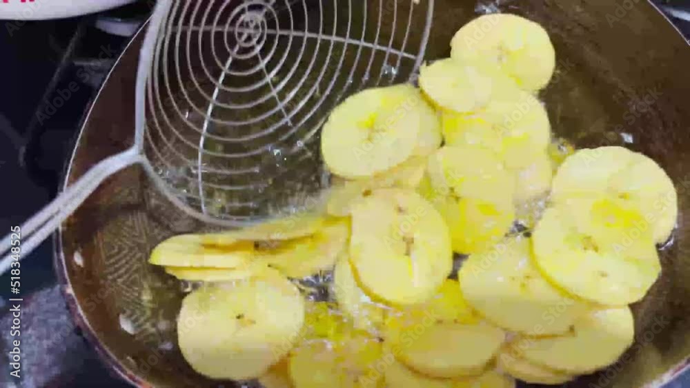 Woman frying green banana in hot oil 4K Man cooking on the stove. Fried ...