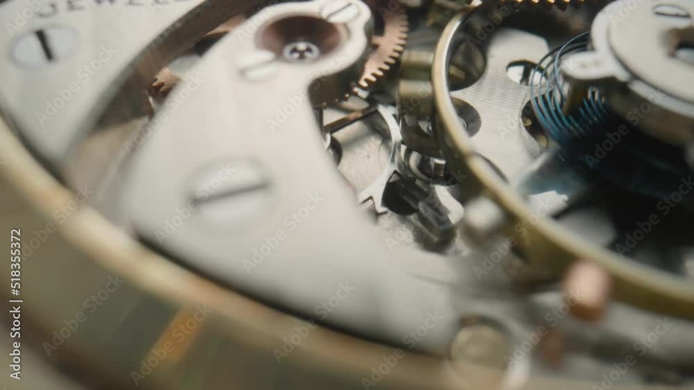 Moving metal gears inside working pocket watch mechanism. Working clock ...