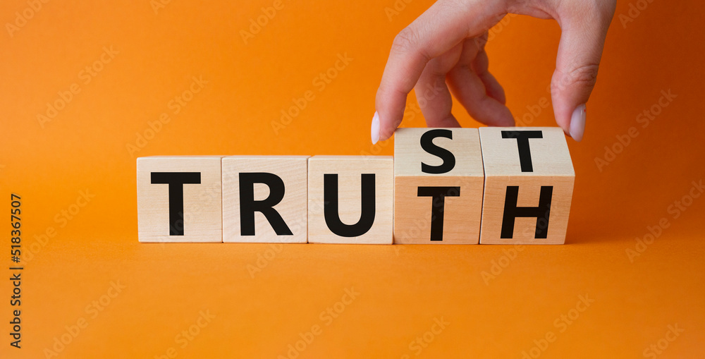 Trust and Truth symbol. Businessman Hand turns a cube and changes the ...