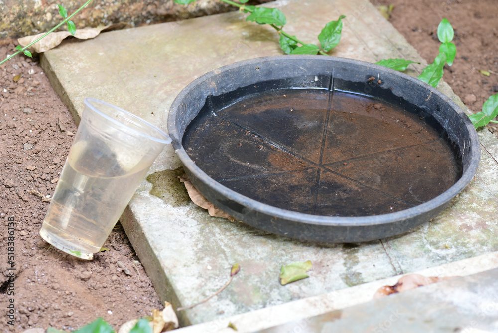 abandoned plastic packaging with stagnant dirty water inside. close ...