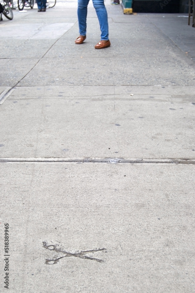 Sidewalk Scissors Imprint in Concrete with a Person’s Legs in the ...