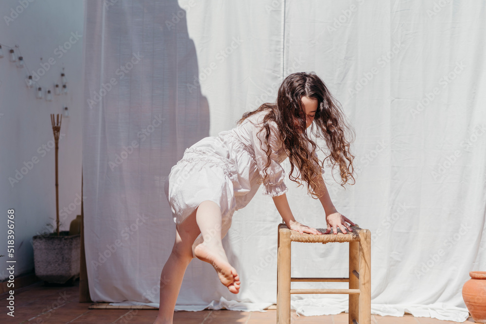 Barefoot girl in white dancing at terrace Stock Photo | Adobe Stock