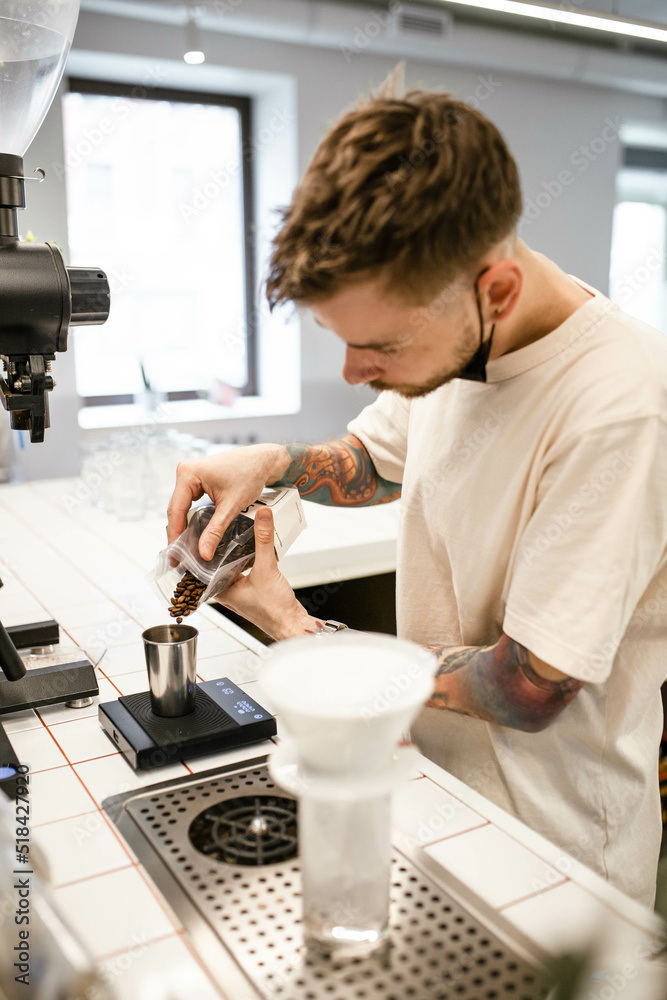 The process of brewing a coffee funnel in a coffee shop Stock Photo ...