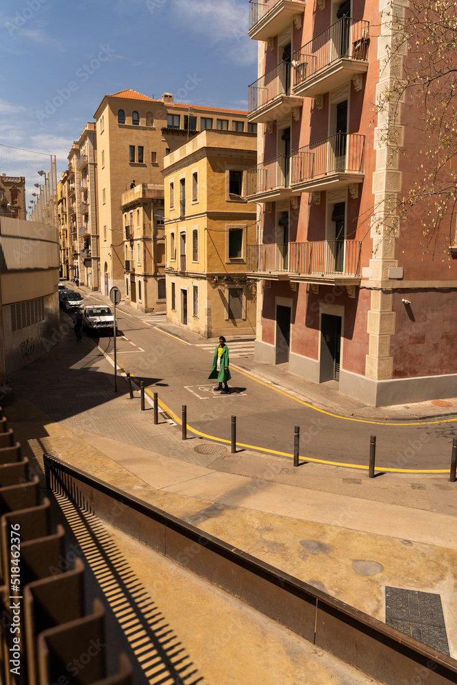 Remote male model posing with buildings at street middle Stock Photo ...