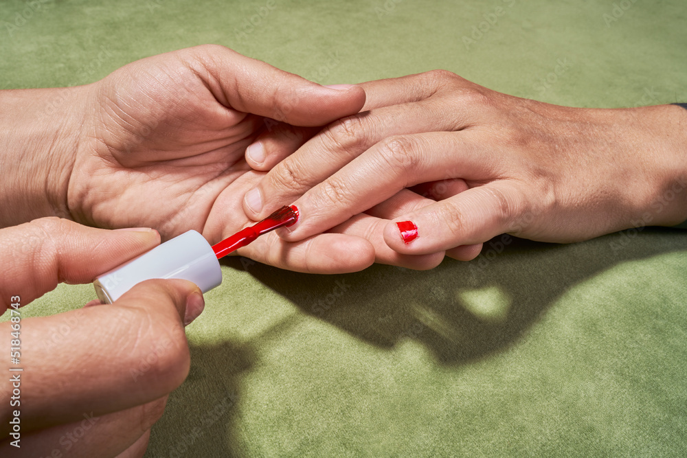 Painting the nails of a transgender person Stock Photo | Adobe Stock