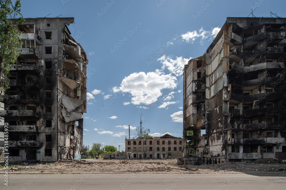 Facade of a bombed-out apartment building. Stock Photo | Adobe Stock