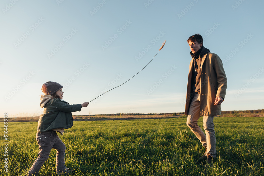 Little girl attack dad with a cane Stock Photo | Adobe Stock