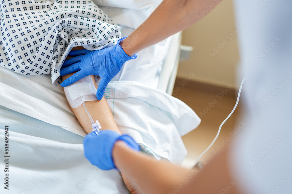 Nurse giving intravenous analgesic Stock Photo | Adobe Stock