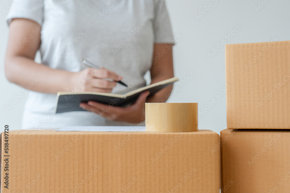 Woman business owner check the parcel before delivery process. Quality ...