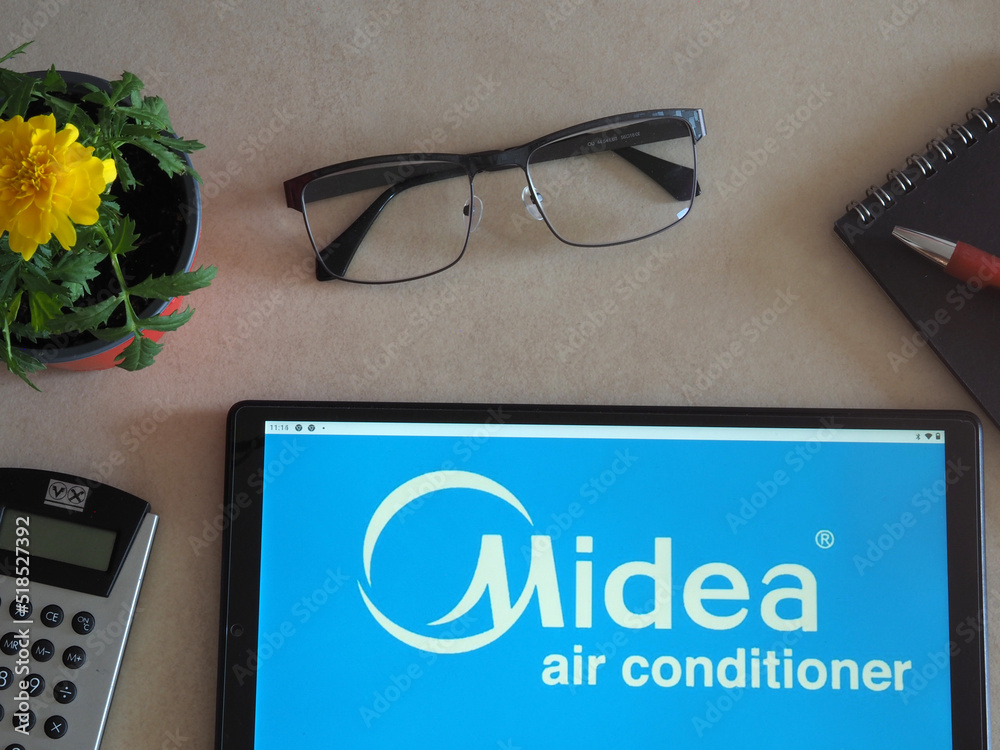 In this photo illustration, Midea Group logo seen displayed on a tablet ...