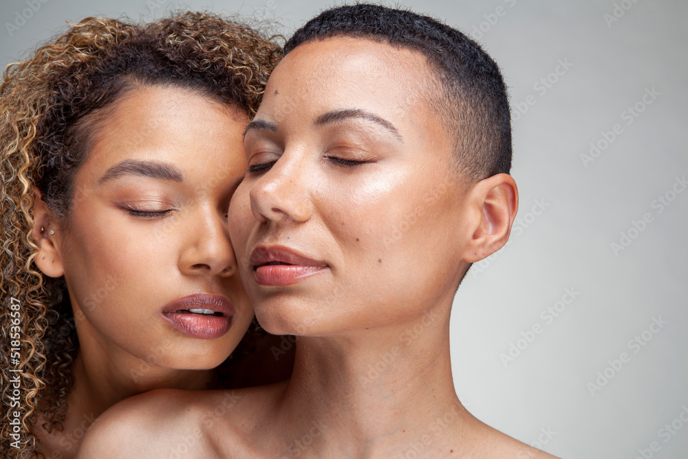 Studio portrait of two women cheek to cheek Stock Photo | Adobe Stock