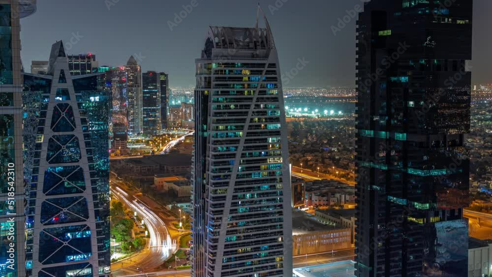 Tall residential buildings at JLT district aerial night timelapse, part ...