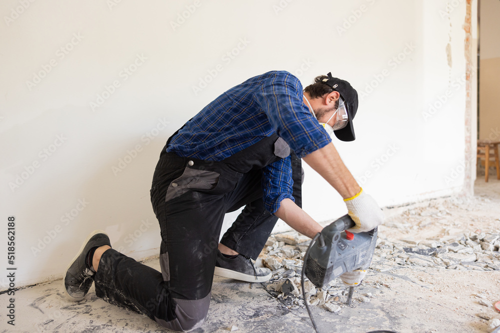 Experienced laborer working for years on construction sites renovates ...