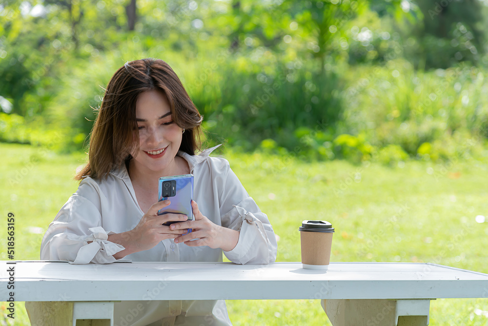 beautiful asian woman look at mobile look social media or buy shopping ...