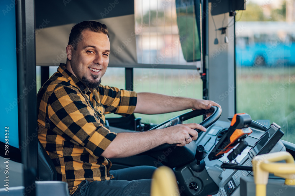 Bus driver behind the wheel of a public transport vehicle Stock Photo ...