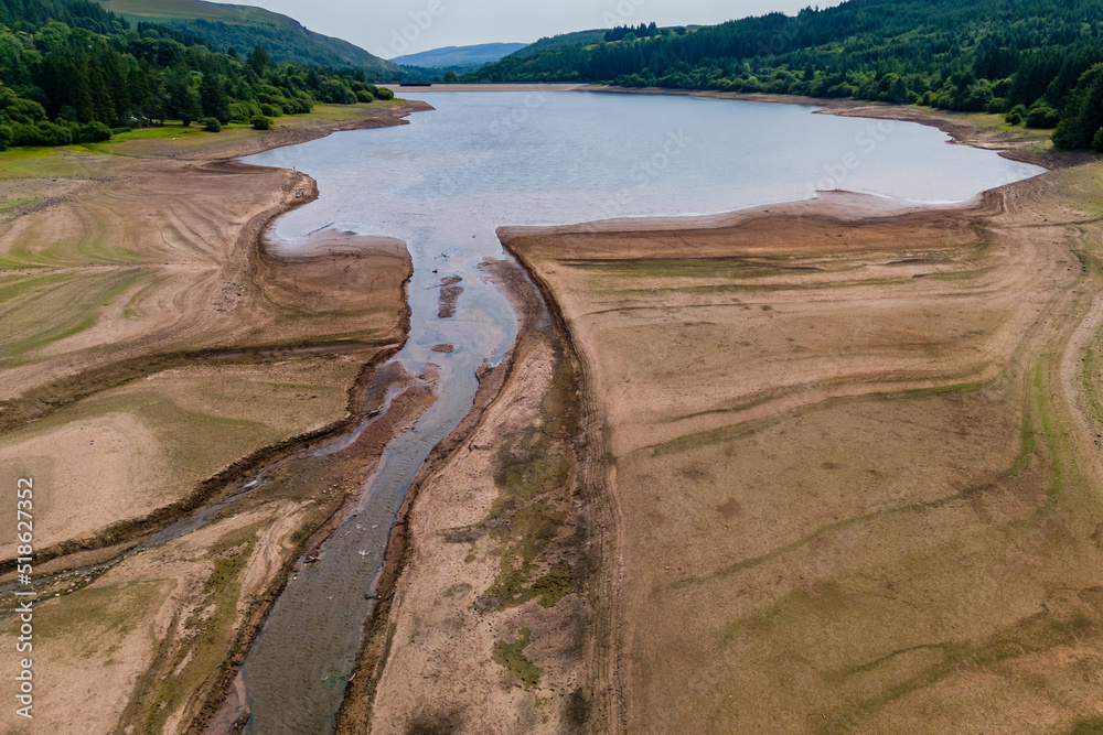 Aerial view of extremely low water levels at a reservoir during a ...