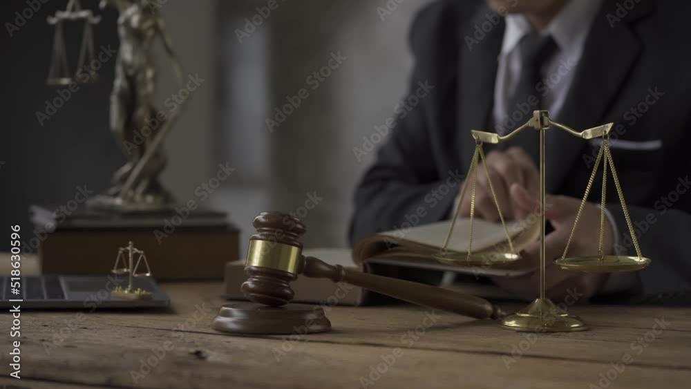 Lawyer's office reads the law book in the office. Footage features a ...