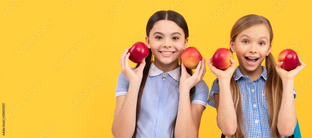 Happy children back to school holding apples for healthy eating ...