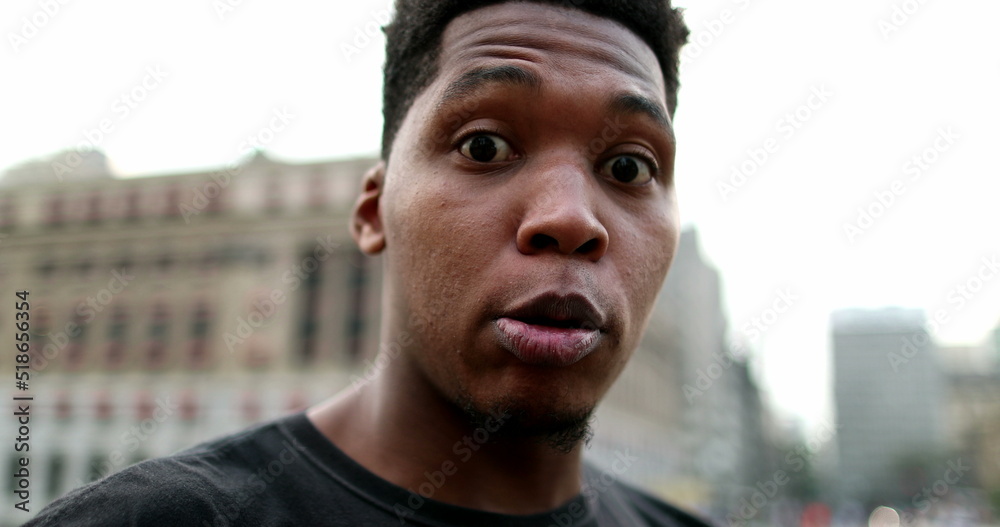 Black man shock reaction. African guy reacting with surprise to news ...