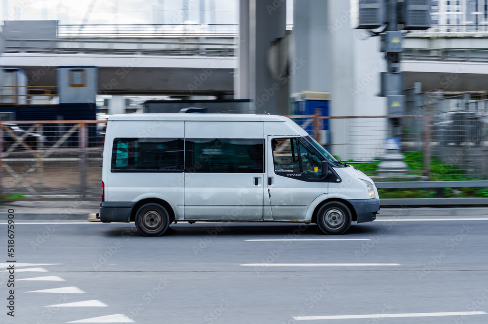 Ford Transit Third generation in the city street. Side view of white ...
