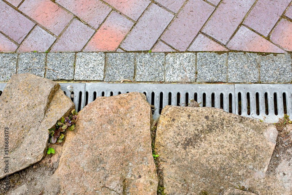 iron lattice line of drainage system of pedestrian sidewalk made of ...