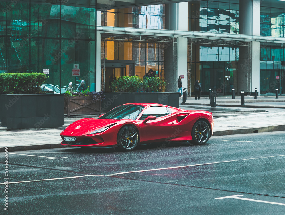 Red Ferrari F8 Spider parked on the street in Moscow. Supercar in front ...