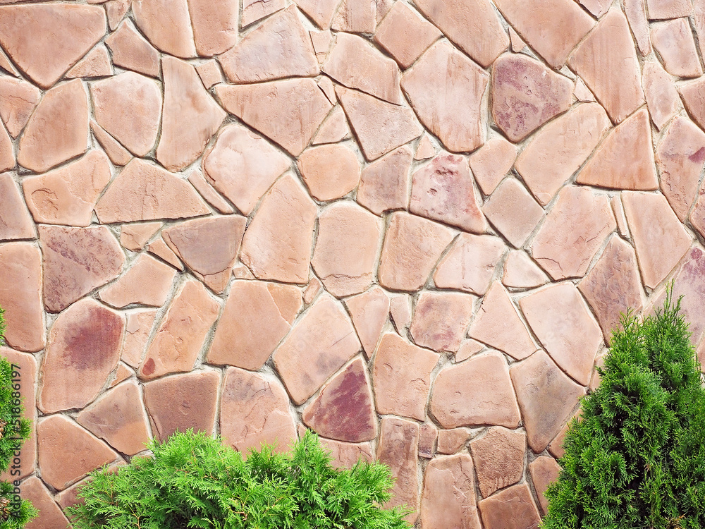 Red sandstone cladding. The outer wall is tiled with granite tiles of ...