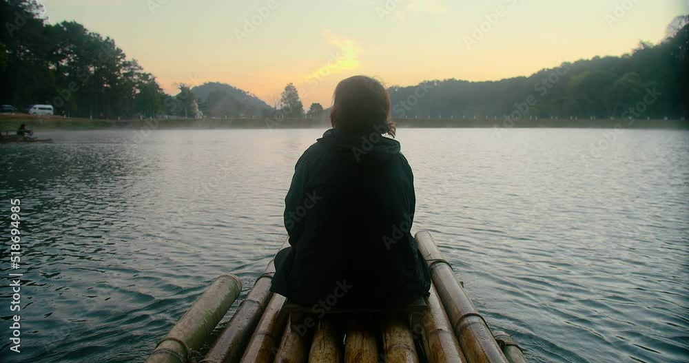 young tourist person woman sitting relaxing on bamboo boat rafting ...