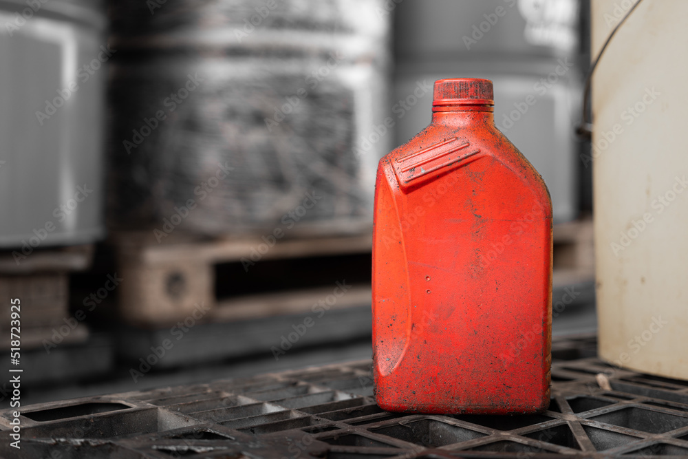 A red chemical bottle without safety information attached, it placed in ...