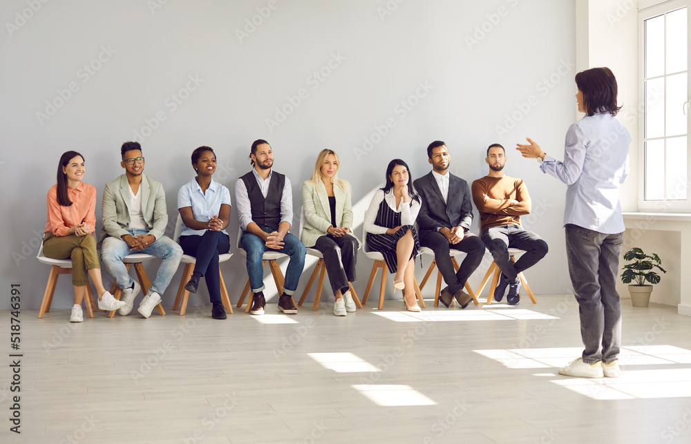 People Listening To Speaker