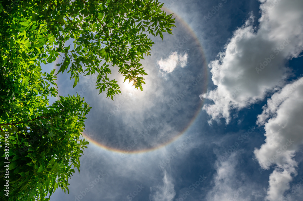 Natural optical phenomenon of sun with halo. Full circle 22° halo ...