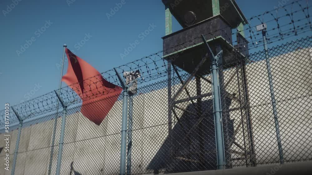 Chinese flag above heavily guarded building, penitentiary, military ...