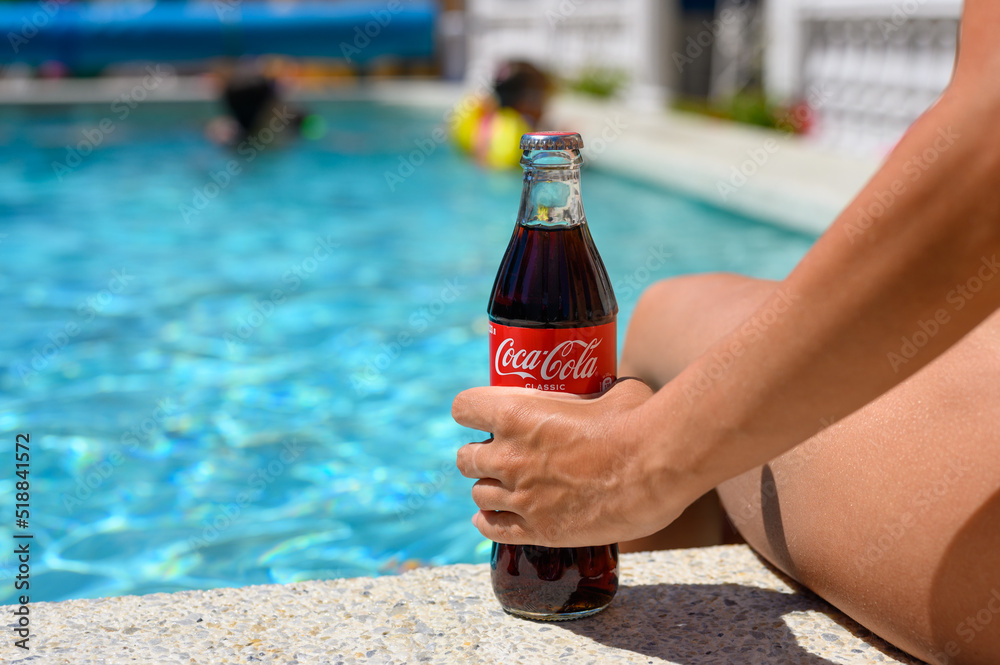 Novorossiysk - Russia, July 2022: A bottle of Coca-Cola in the hand of ...