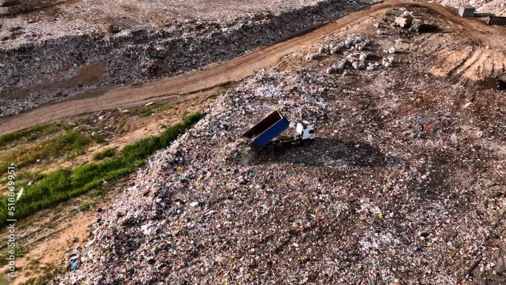 Landfill with storage of solid household waste. Garbage truck unloads ...